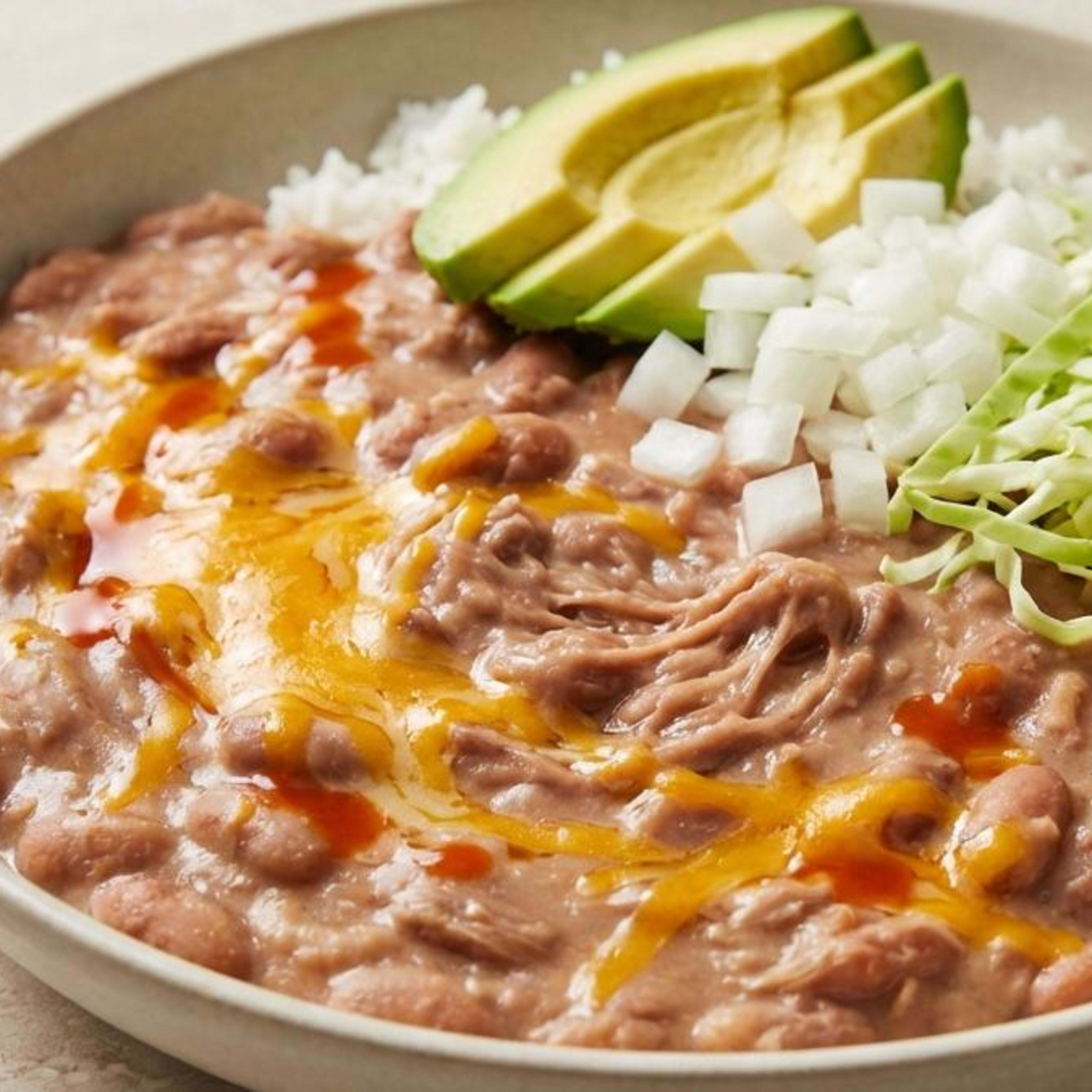 Cheesy Pinto Beans With Rice - Delishably
