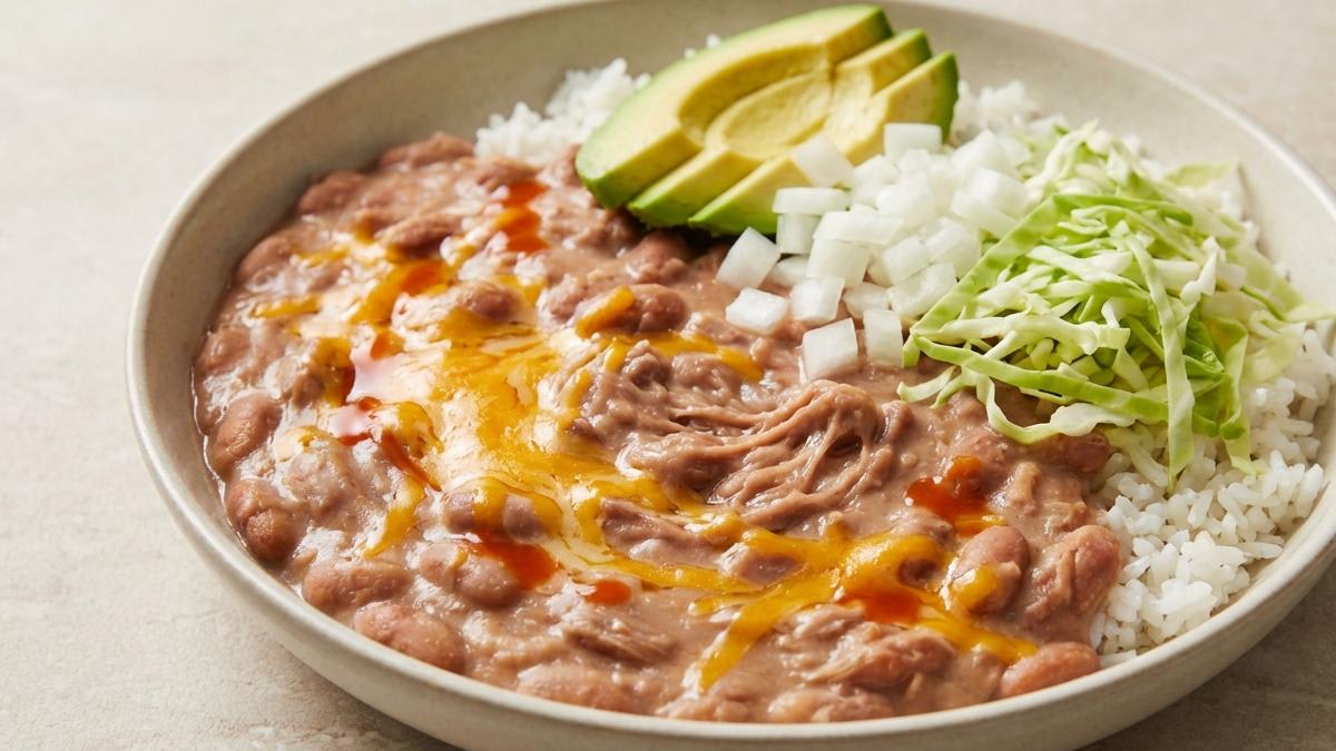 Cheesy Pinto Beans With Rice - Delishably